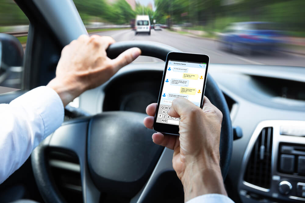 What Are the Most Common Types of Distractions While Driving? - Boohoff ...